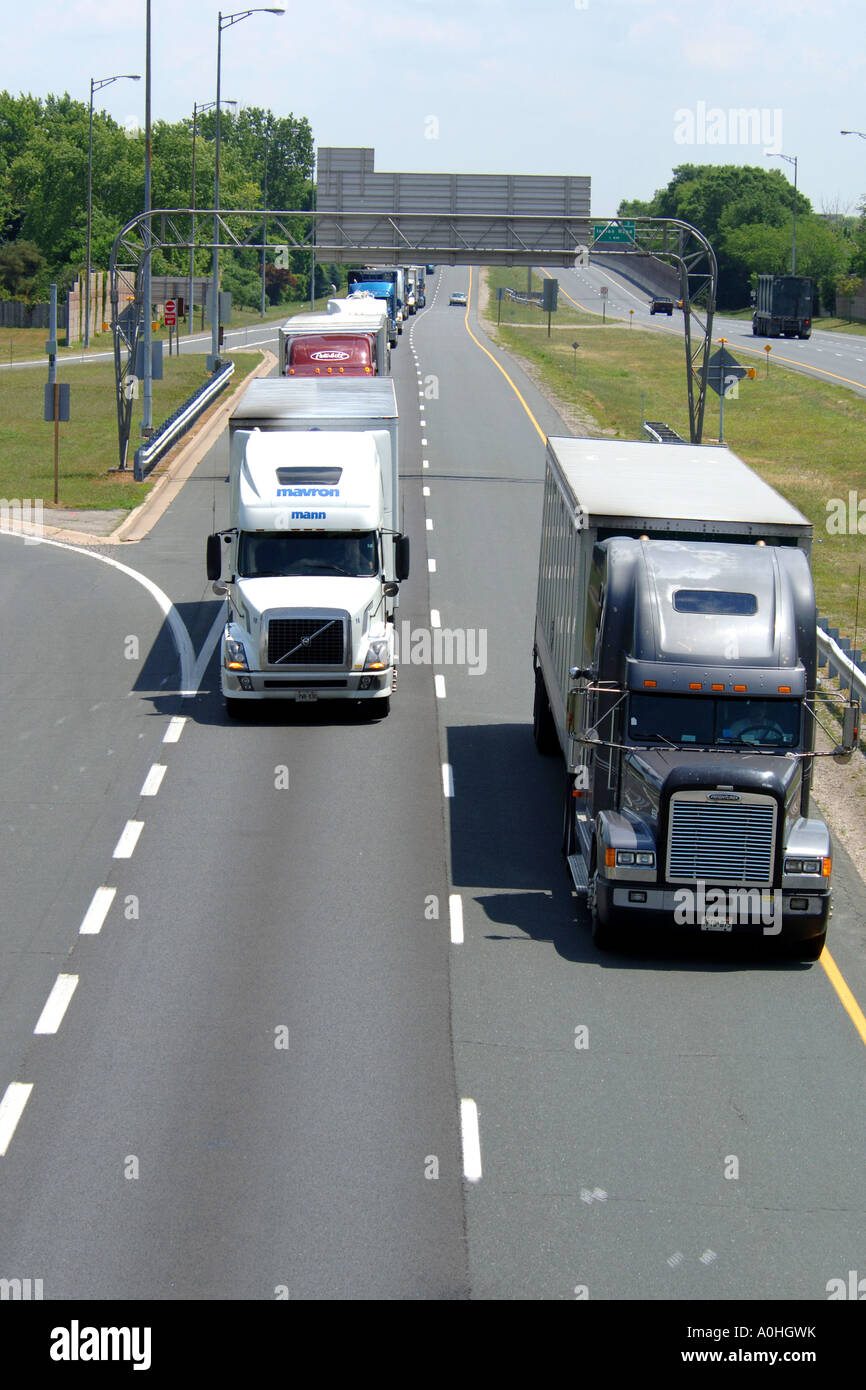Semi Trucks on a two lane highway in Michigan heading to Canada Stock ...