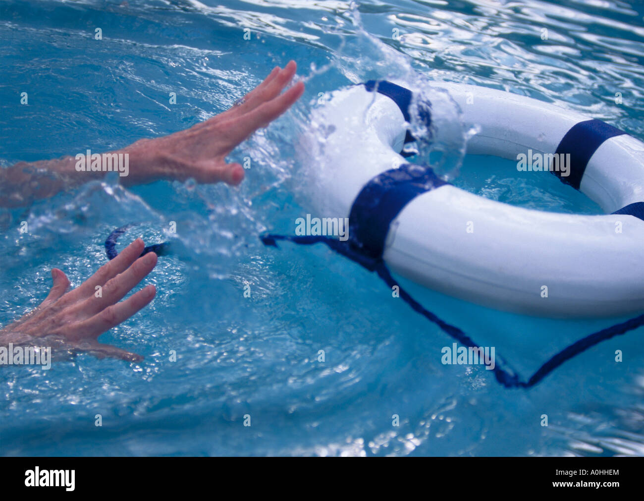 hands reaching for life preserver Stock Photo - Alamy
