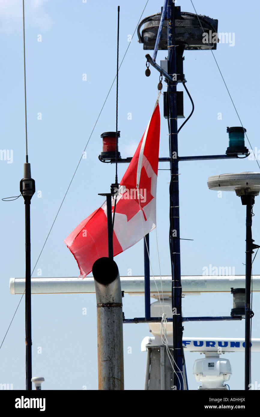Canadian flag flying on a boat mast Stock Photo - Alamy