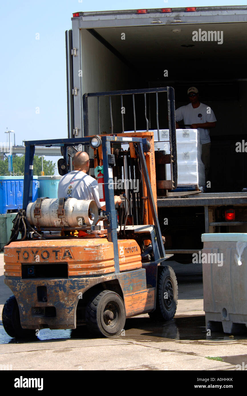 A Forklift truck moving cargo around a factory loading bay in Michigan ...