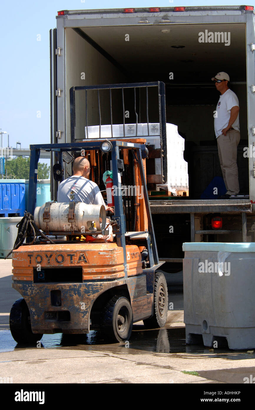 A Forklift truck moving cargo around a factory loading bay in Michigan ...