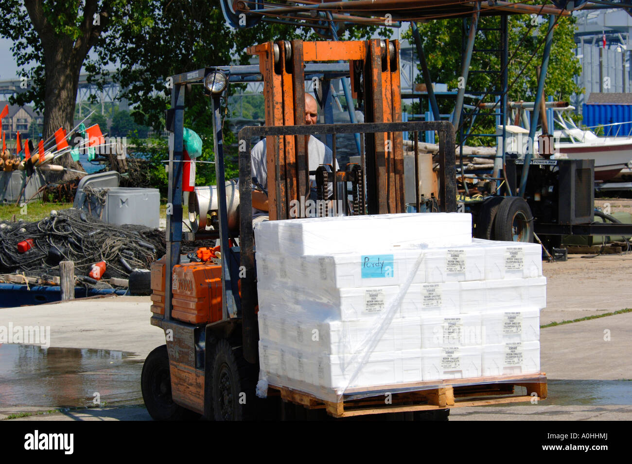 A Forklift truck moving cargo around a factory loading bay in Michigan ...