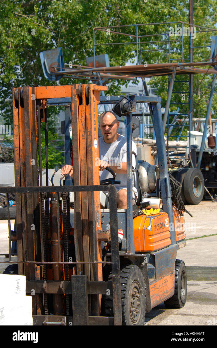 A Forklift truck moving cargo around a factory loading bay in Michigan ...