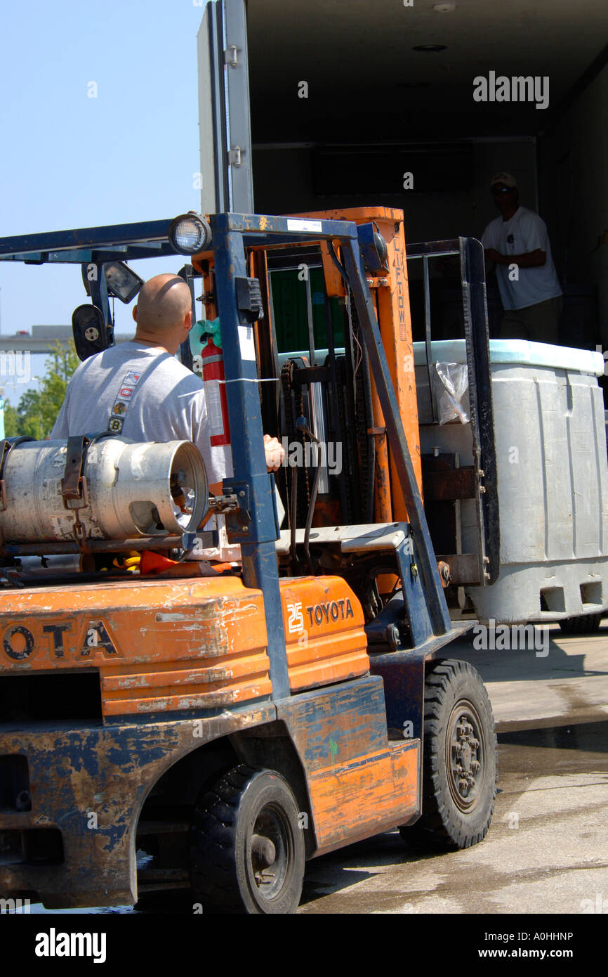 A Forklift truck moving cargo around a factory loading bay in Michigan ...