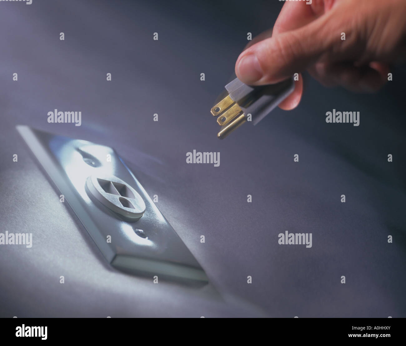 hand plugging in electric plug Stock Photo - Alamy