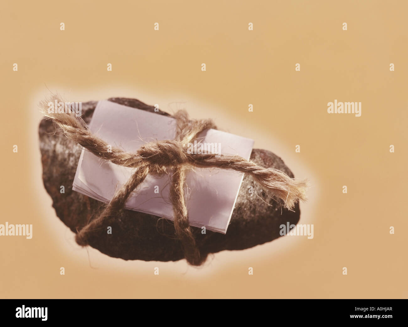 message tied to rock Stock Photo - Alamy