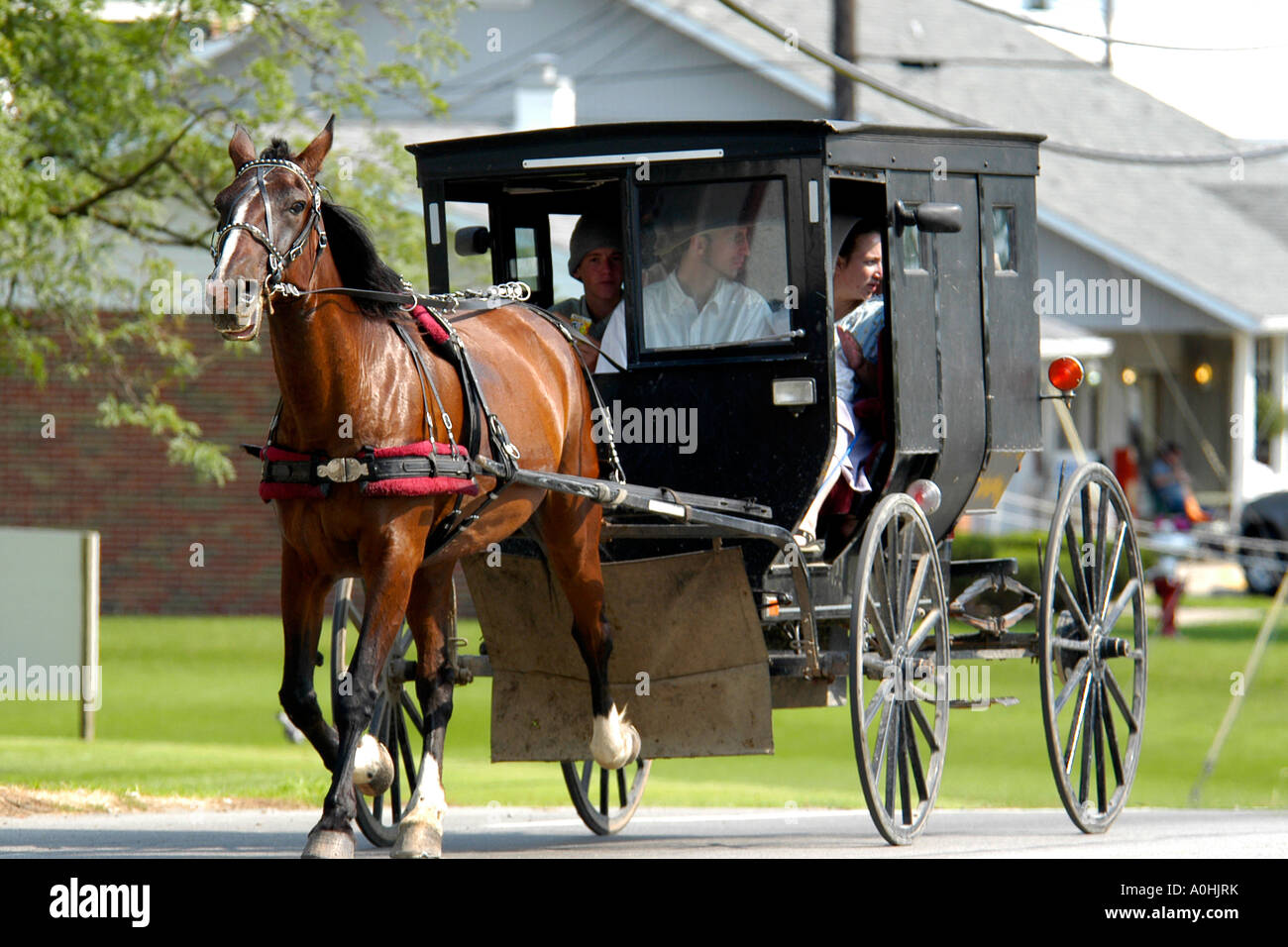 Amish horse drawn buggy on the highway in Shipshewana, Indiana Stock ...