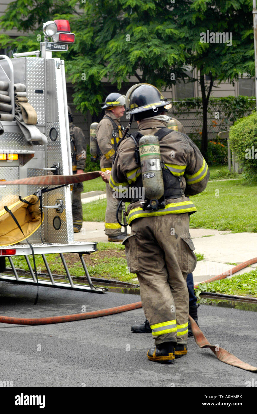 Firefighters wearing breathing aparatus at a fire in downtown Toledo ...