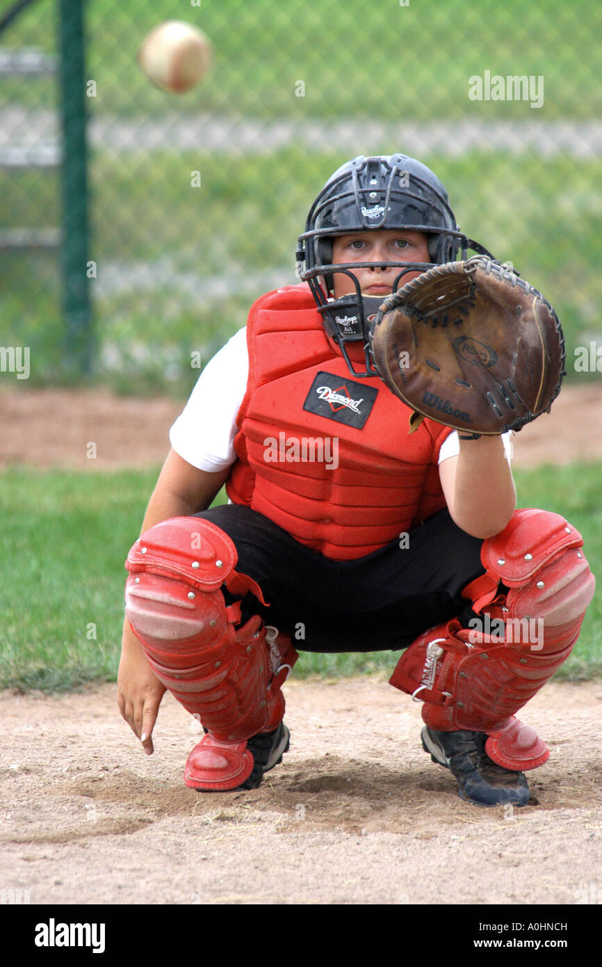 Teenage boy taking part in a softball practice session in Michigan ...