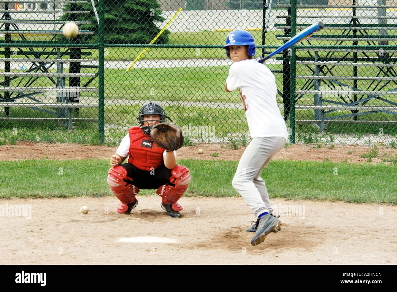 Teenage boys taking part in a softball practice session in Michigan ...