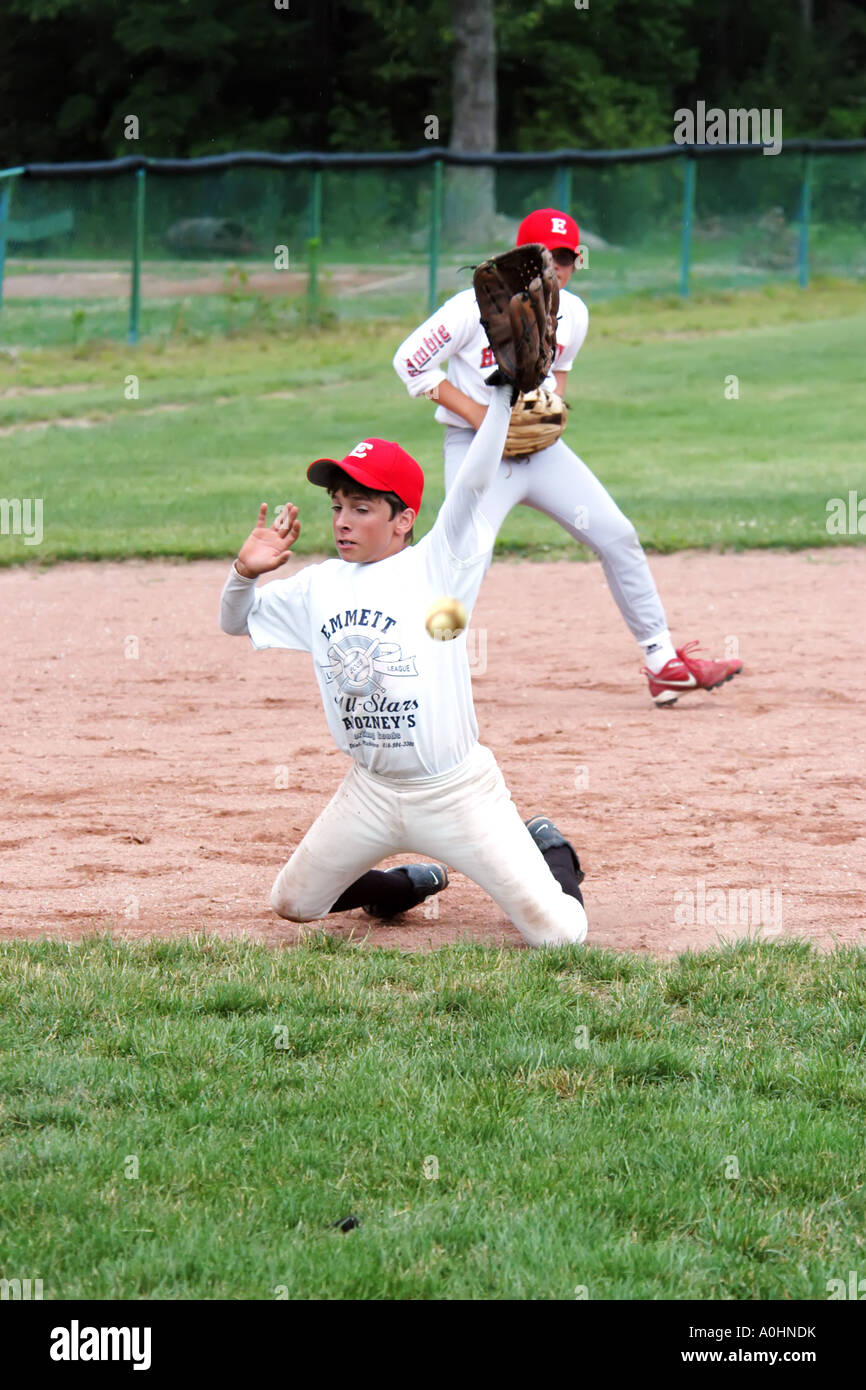 Teenage boys taking part in a softball practice session in Michigan ...