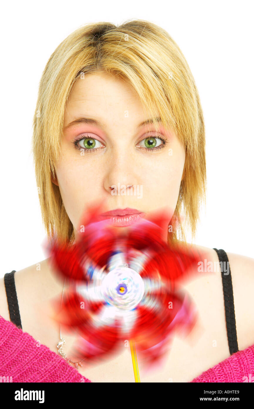 Kid girl blowing windmill hi-res stock photography and images - Alamy