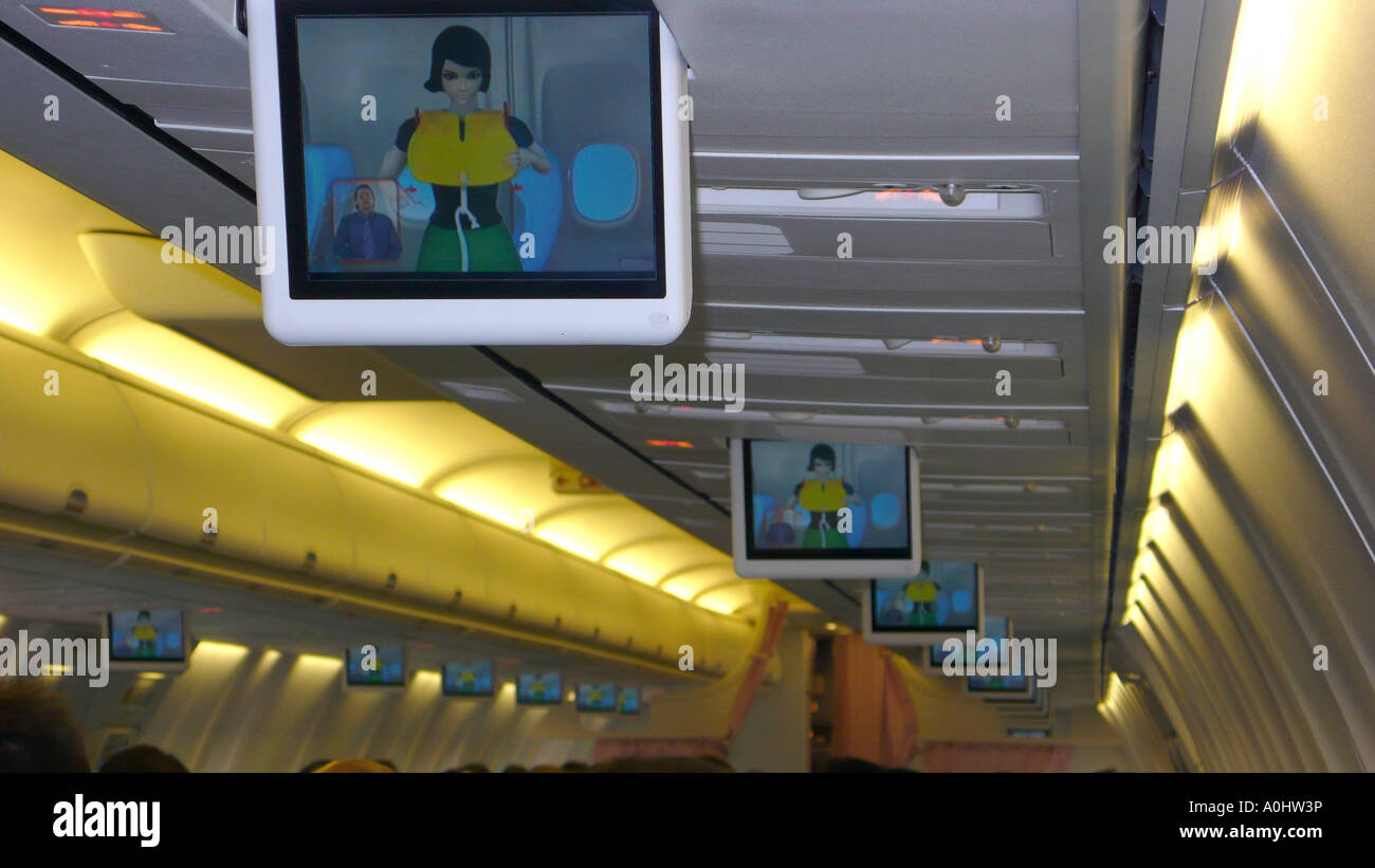 airplane plane inside screen flight safety instruction Stock Photo - Alamy