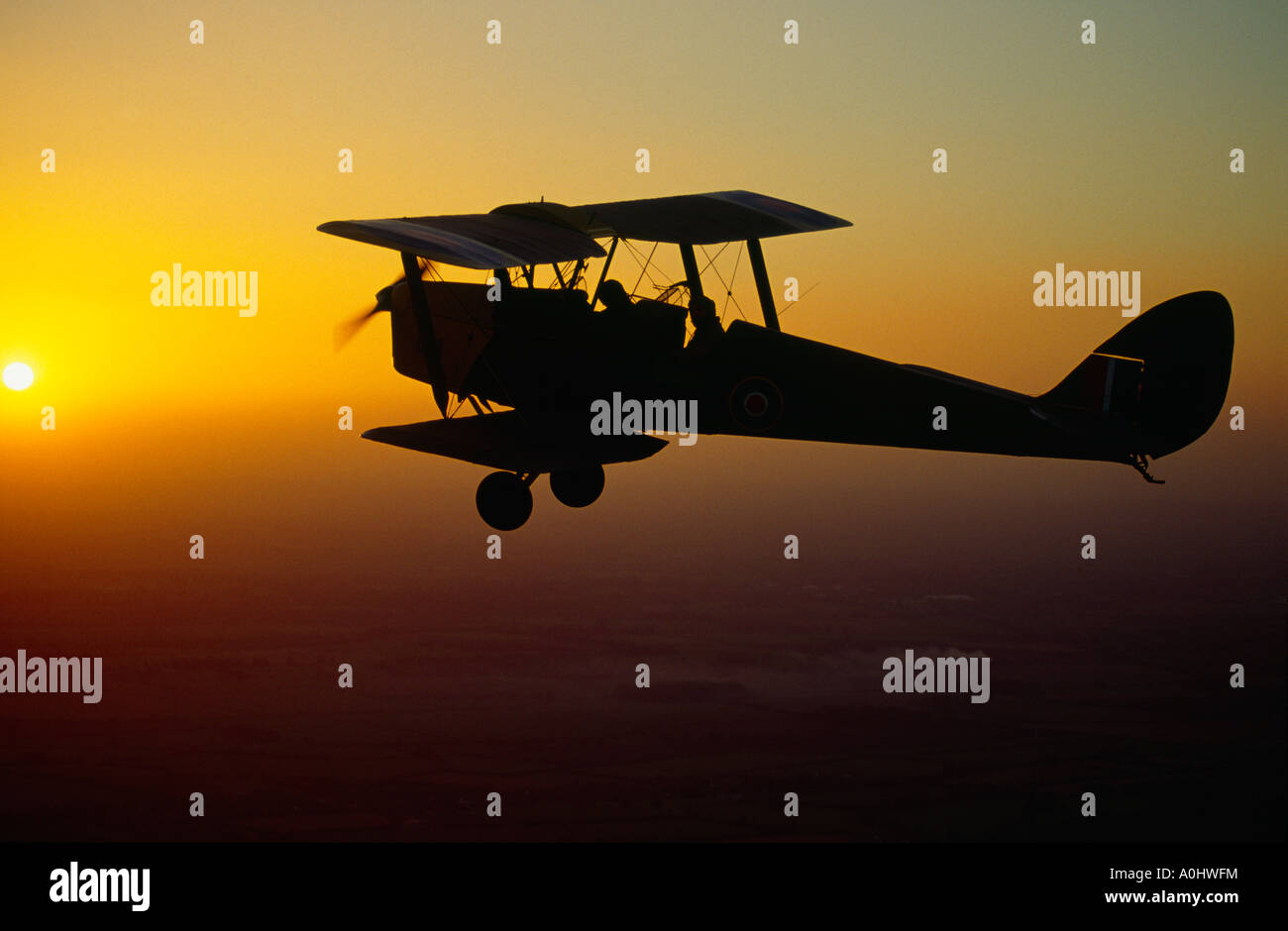 de Havilland DH.82 Tiger Moth in flight at sunset Stock Photo - Alamy