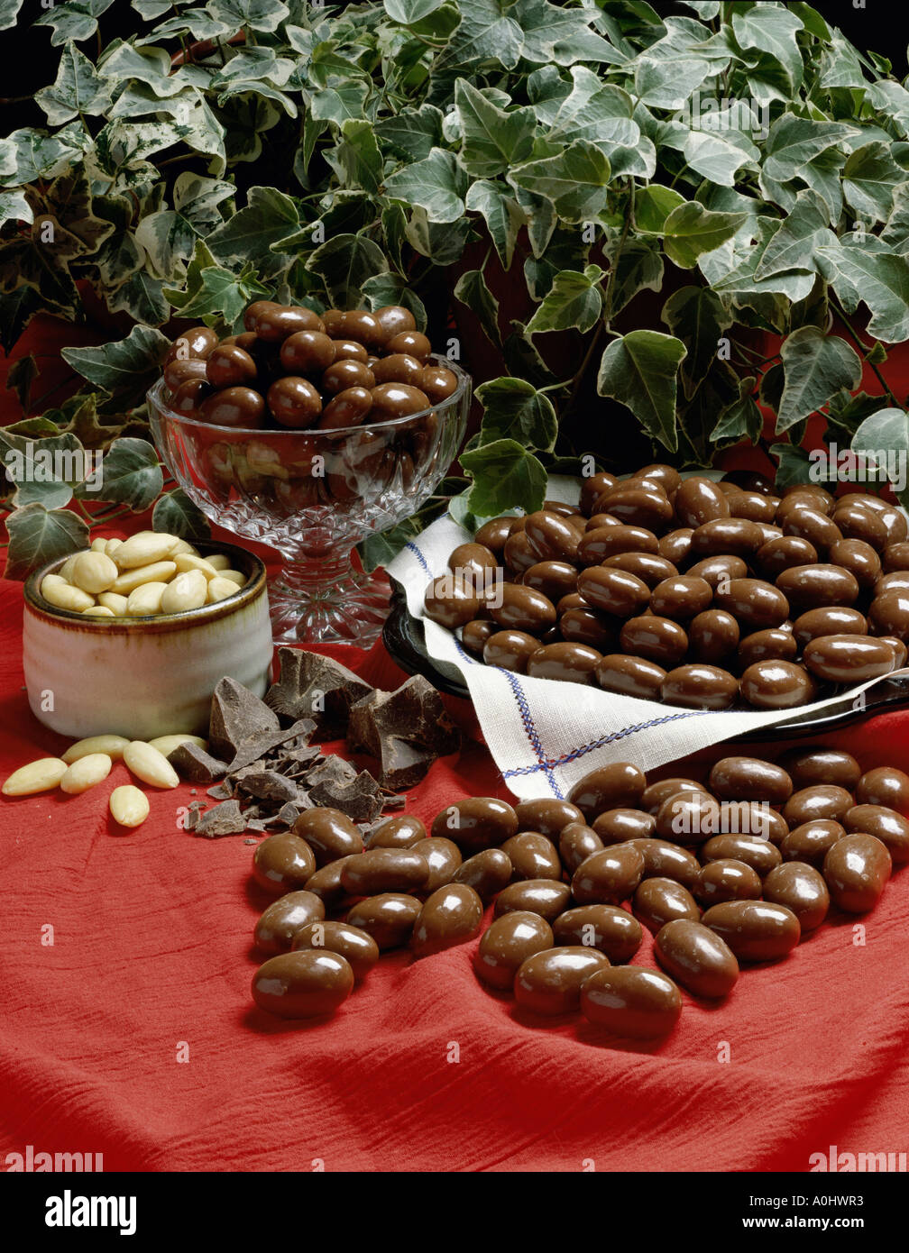 Chocolate coated nuts served in a platter and bowl Stock Photo - Alamy
