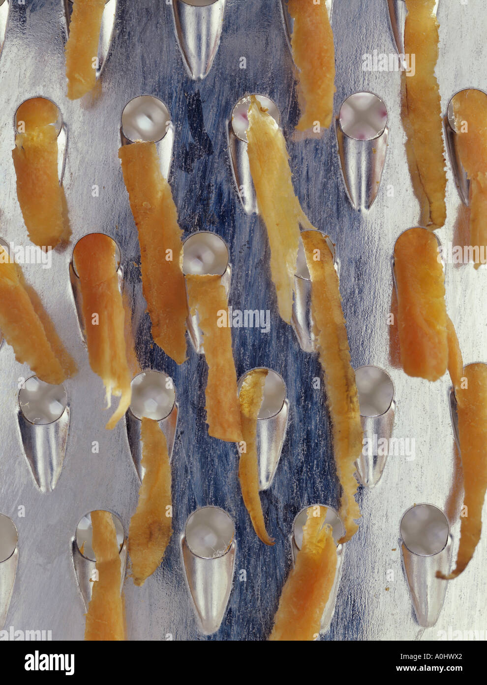Cheese being grated hi-res stock photography and images - Alamy