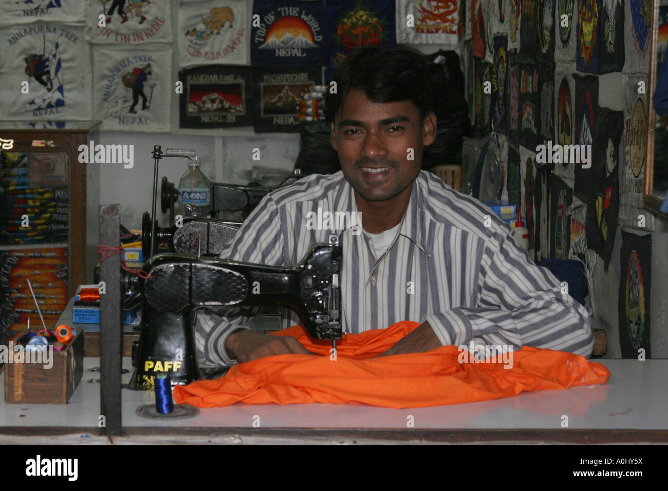 Young salesman operating sewing machine hi-res stock photography and ...