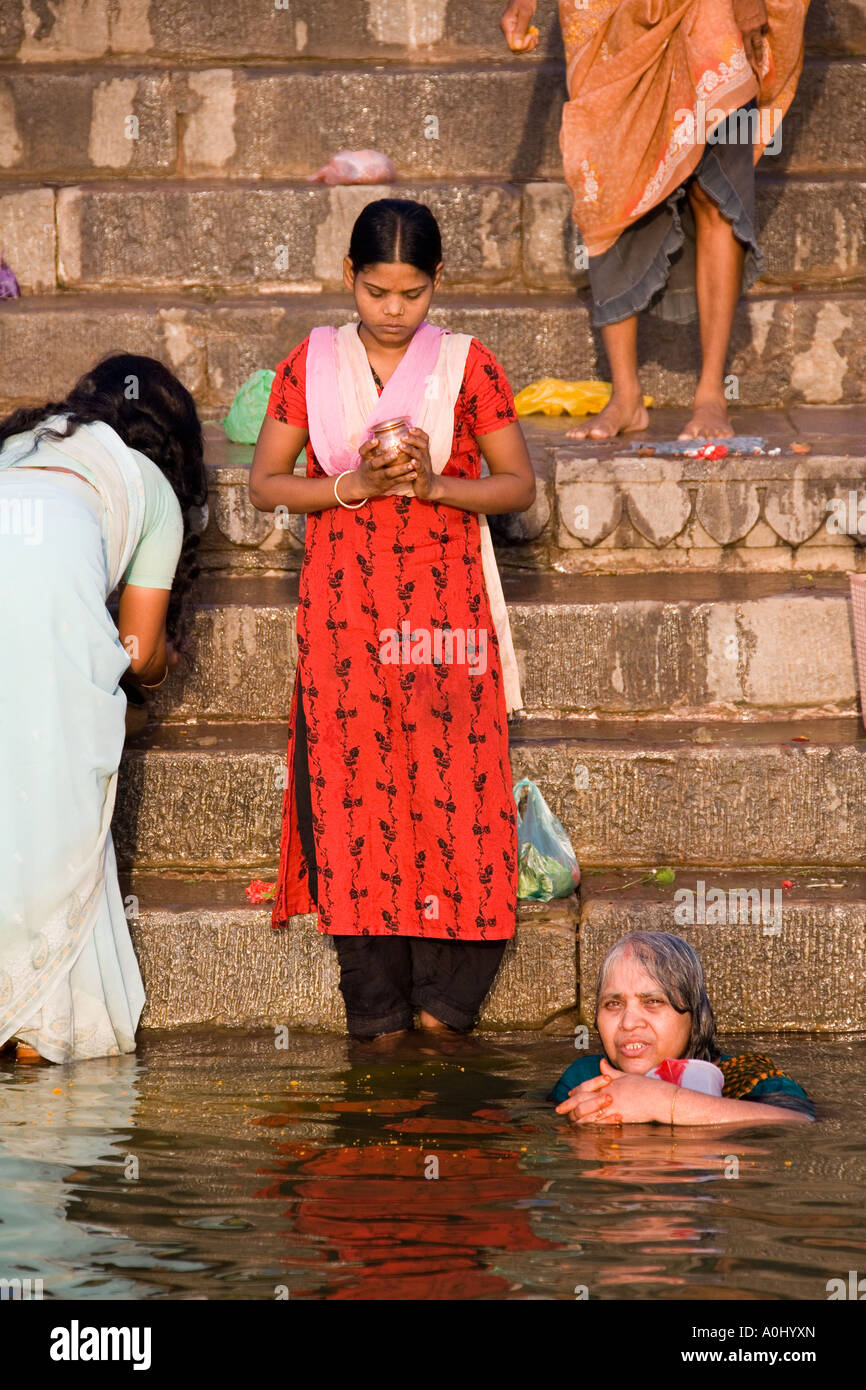 Hindu pilgrims bathing at the Ghats on the West Bank of the River ...