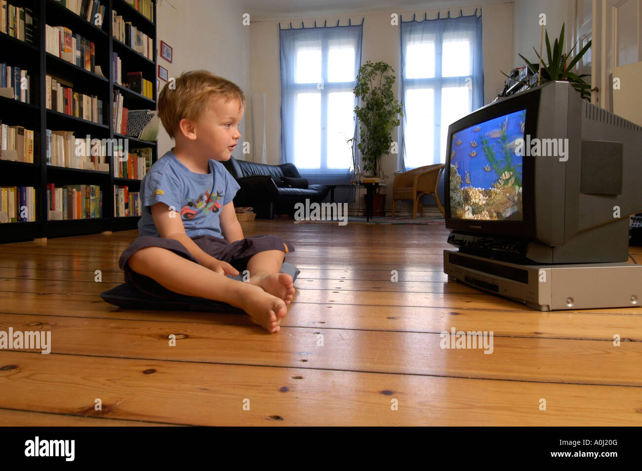 Child watching a video Stock Photo - Alamy
