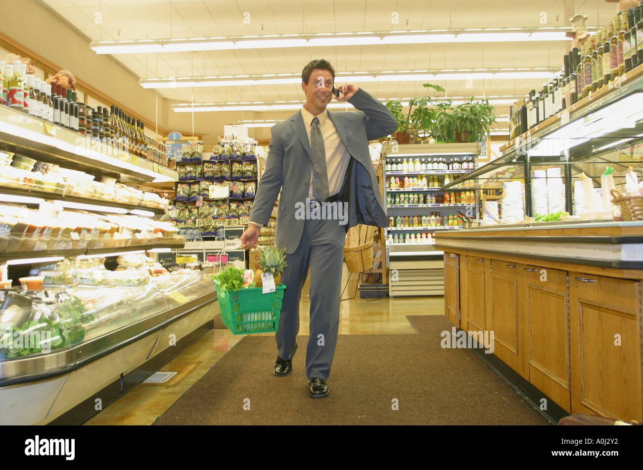 Young man in a grocery store Stock Photo - Alamy