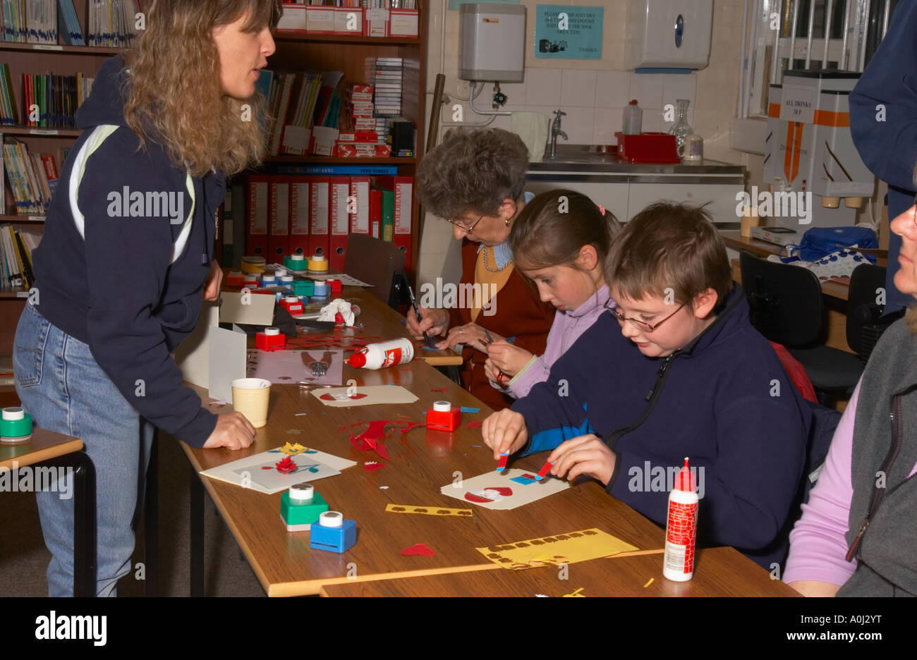 School Teacher with Pupils Creating Cards Stock Photo - Alamy