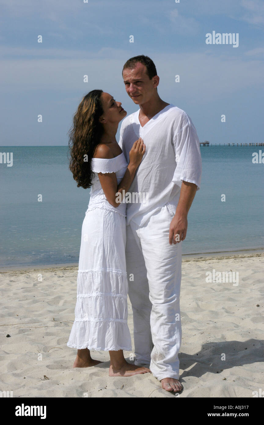 Jade and Tim together on Mutiara Beach Stock Photo - Alamy
