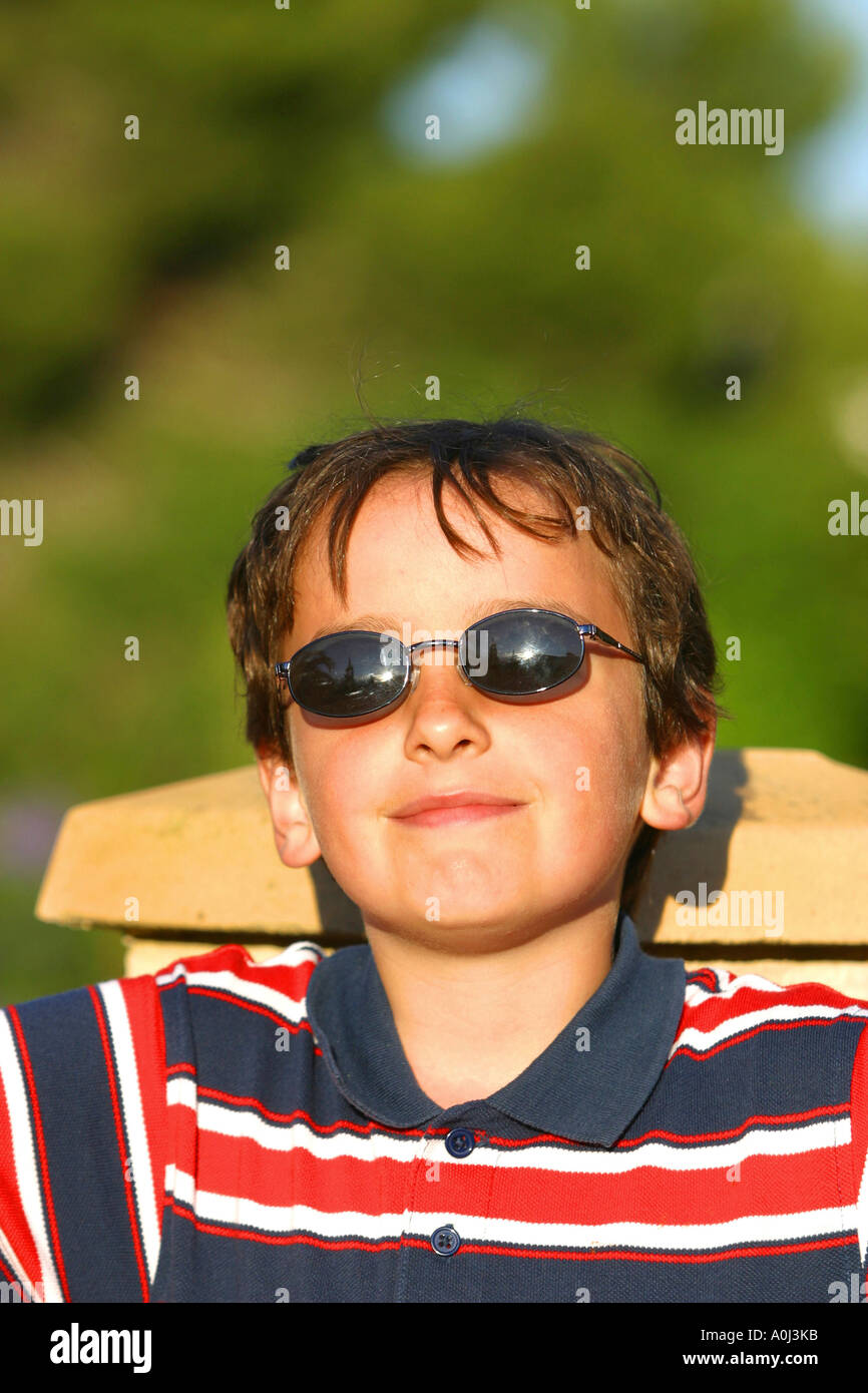 Boy sitting on a chair hi-res stock photography and images - Alamy