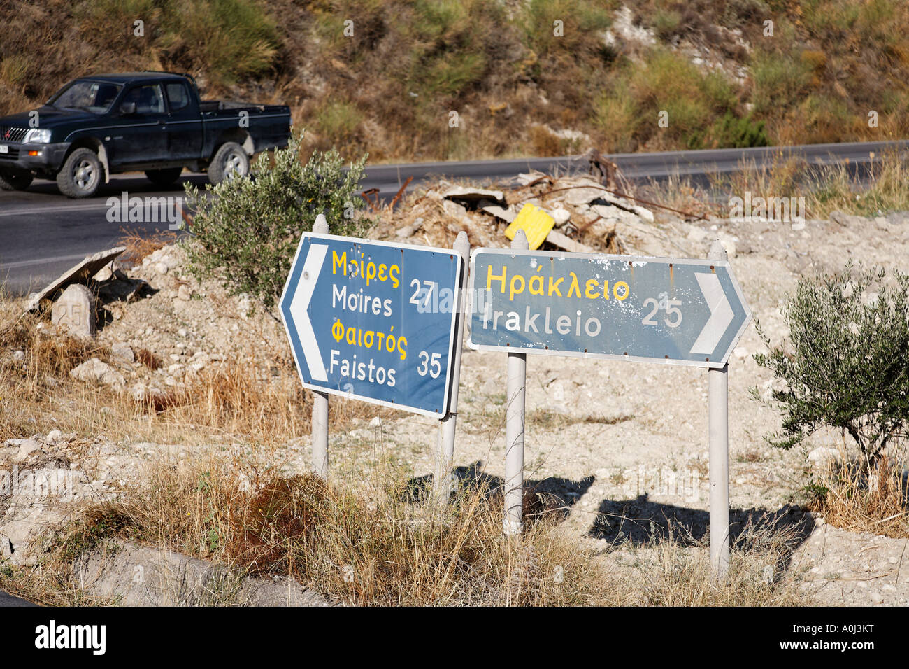 Direction sign at street in Crete, signs to Moires, Faistos, Iraklion ...