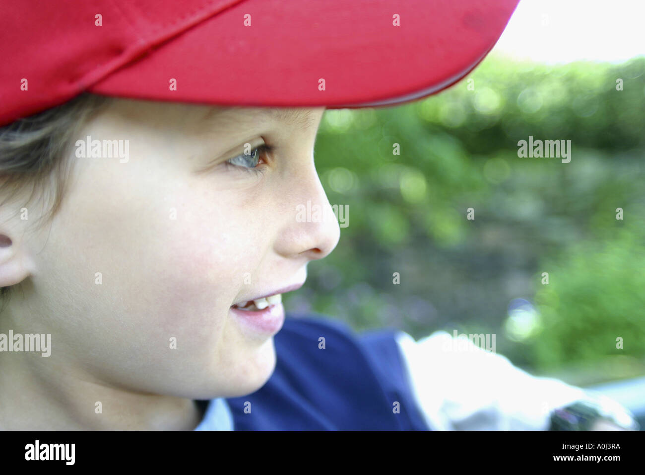 Side profile of a boy wearing a cap Stock Photo - Alamy