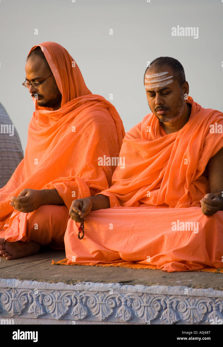Pilgrims at the Hindu Ghats on the Holy River Ganges in Varanasi in the ...