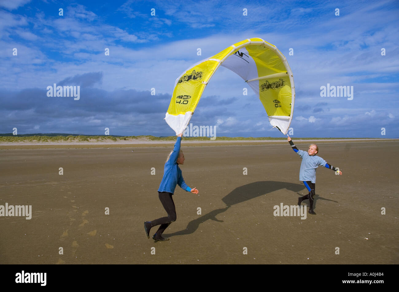 Boy running down the beach hi-res stock photography and images - Alamy
