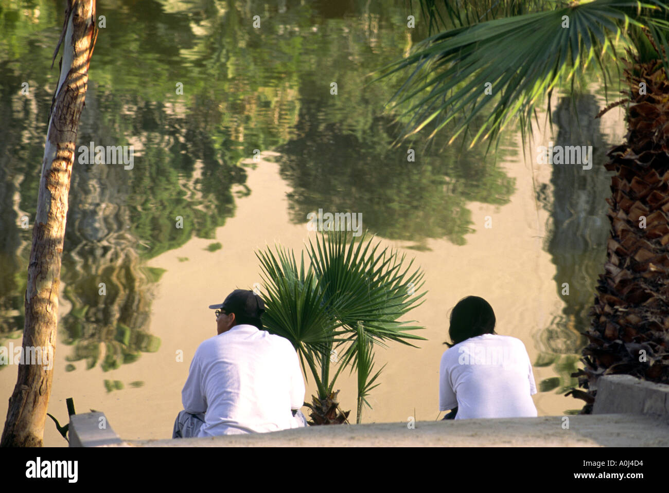 Two figures sitting hi-res stock photography and images - Alamy