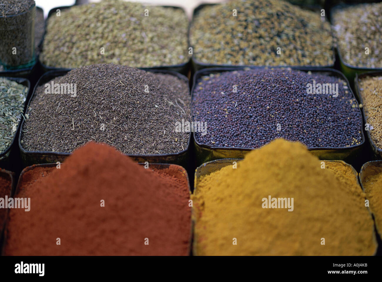 Assorted spices in containers at a market Stock Photo - Alamy