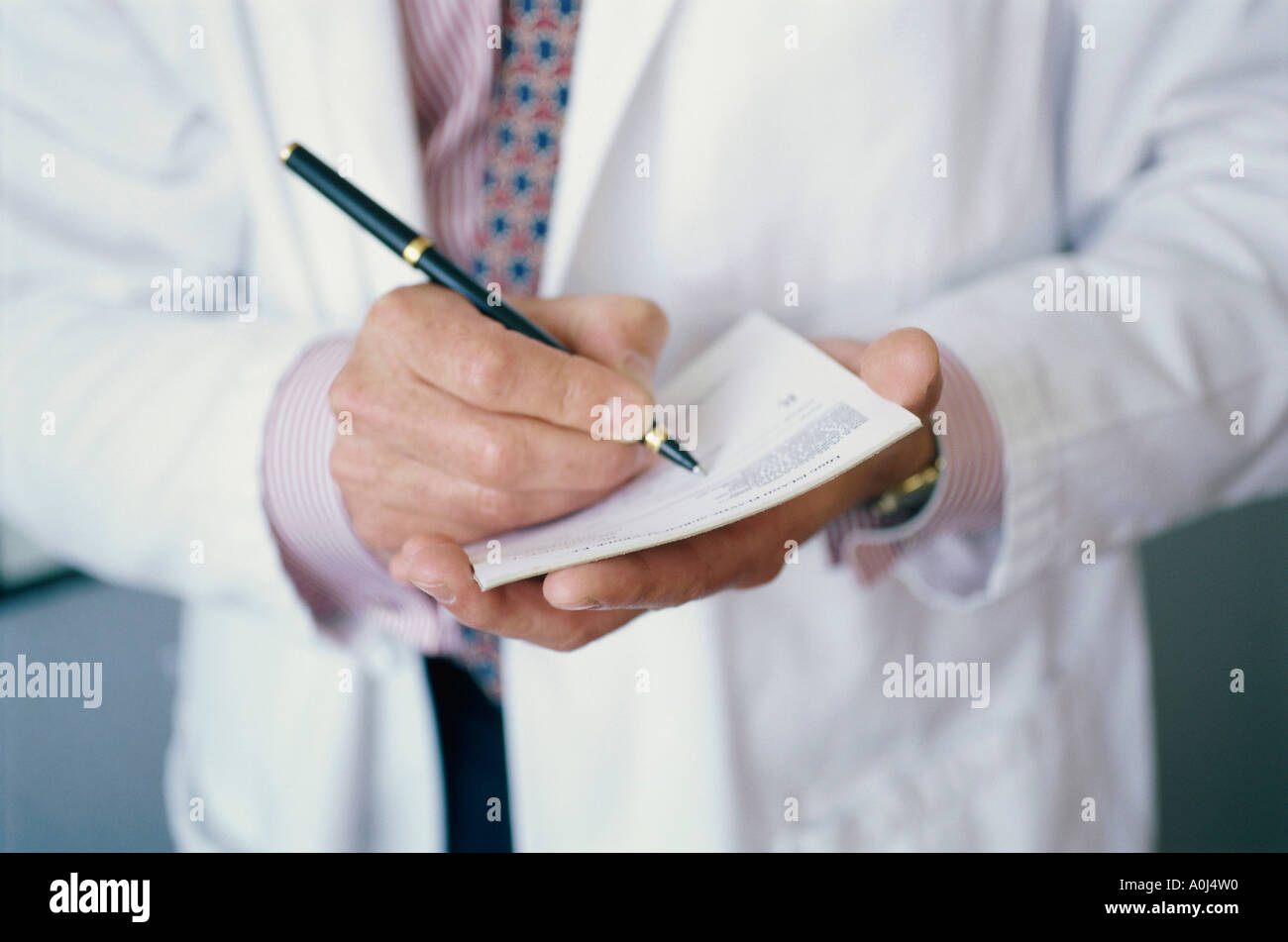 Doctor writing a prescription Stock Photo - Alamy