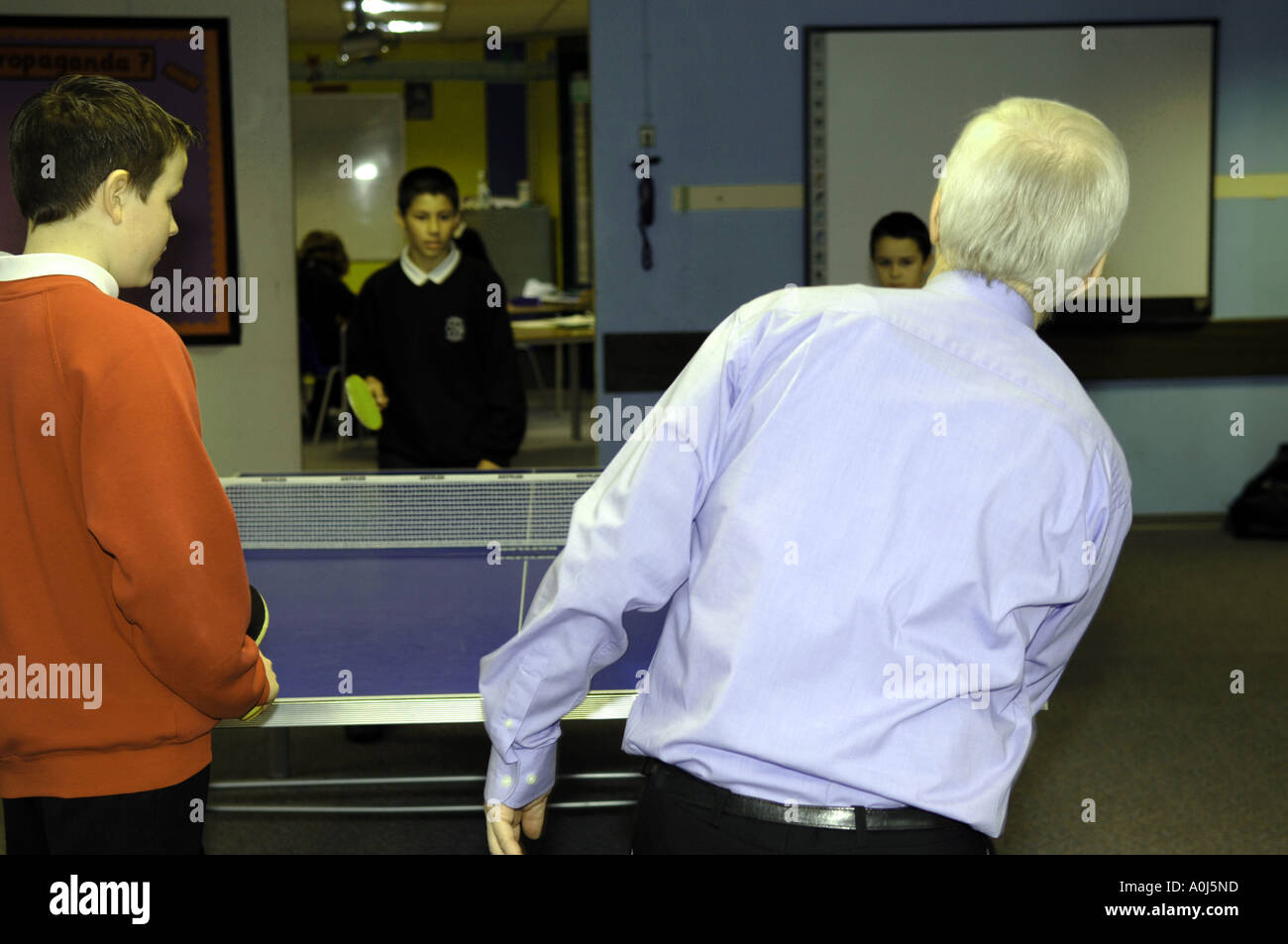 teacher and pupils playing tabletennis Stock Photo - Alamy