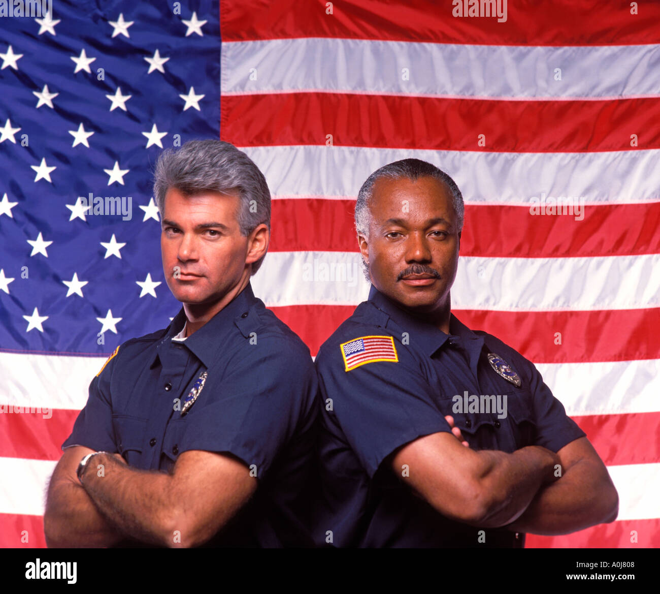 policemen in front of US flag Stock Photo - Alamy