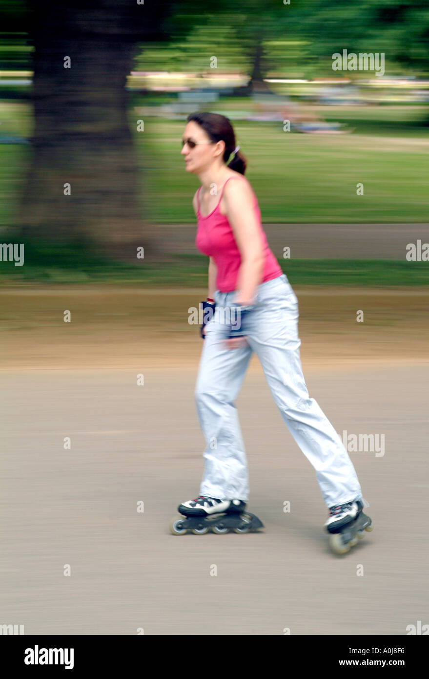 Woman roller blading hi-res stock photography and images - Alamy