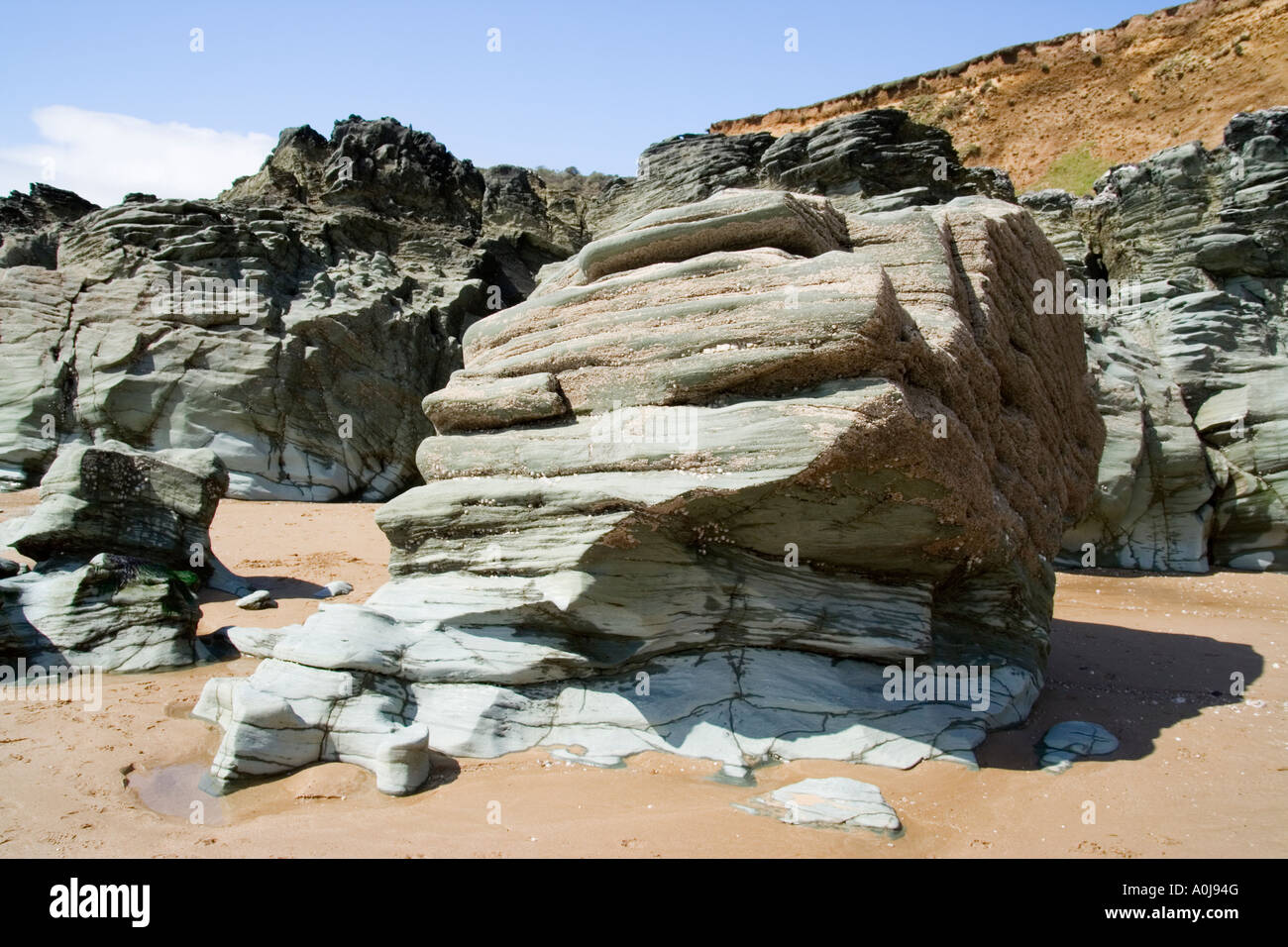 Interesting rock features on beach Stock Photo - Alamy