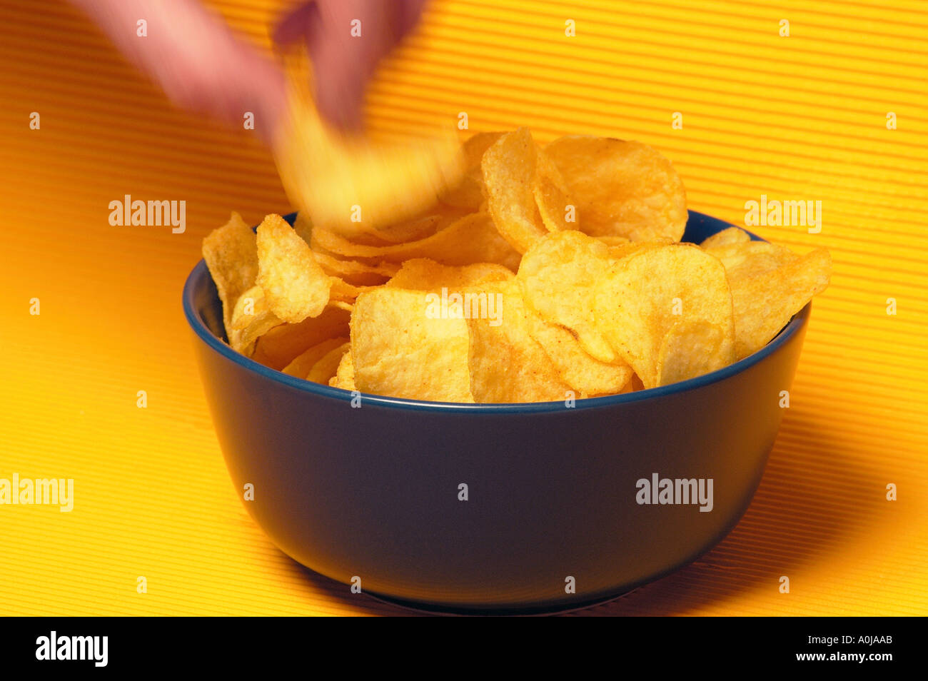 Hand taking potato chip hi-res stock photography and images - Alamy