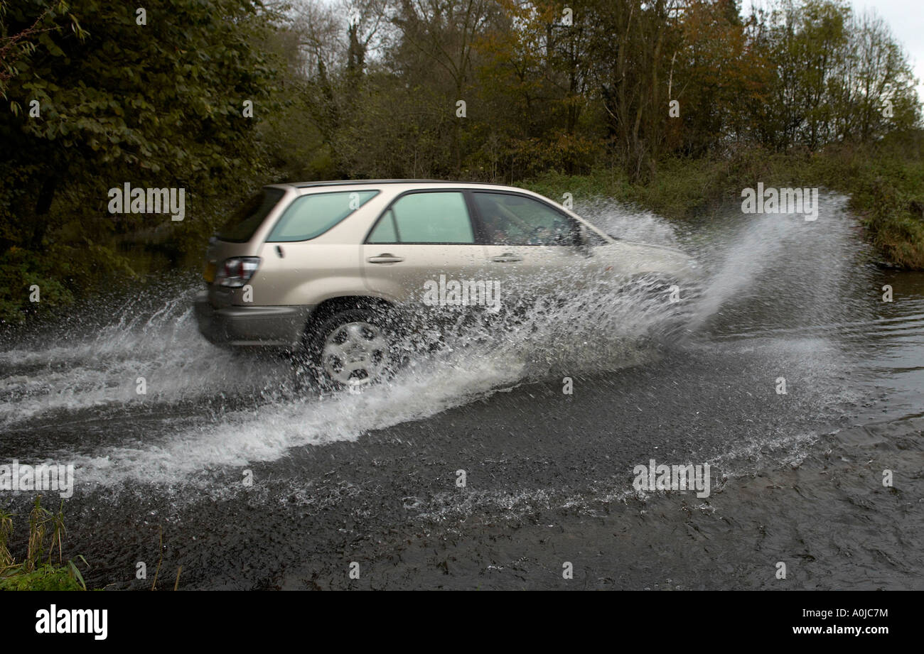 Car crossing a ford Stock Photo - Alamy