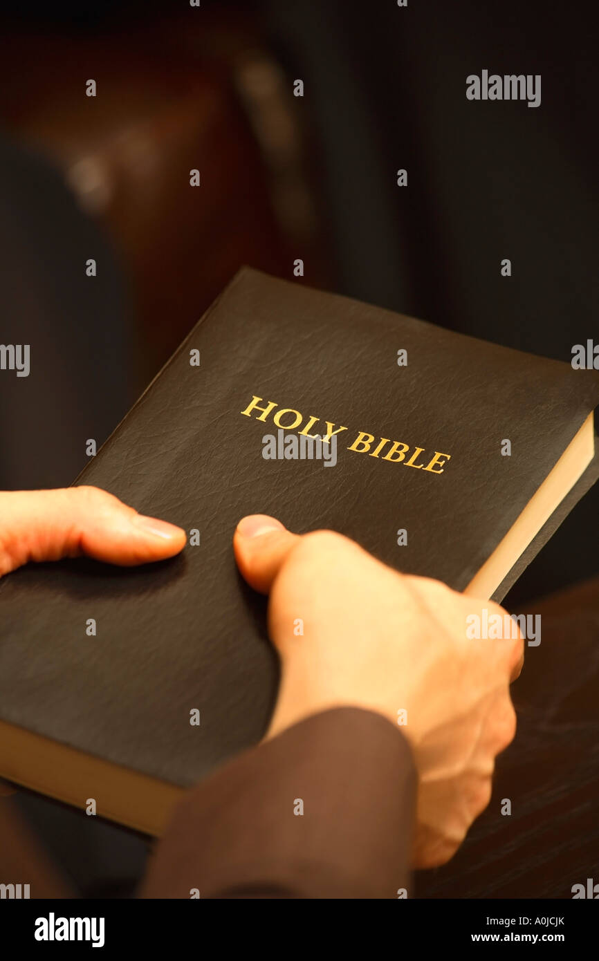Man holding Bible Stock Photo - Alamy