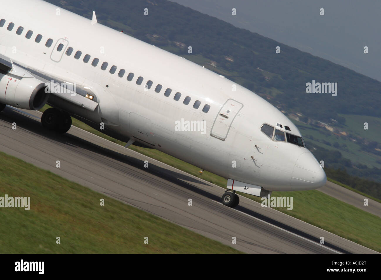 Generic white jet airliner passenger commercial aircraft taking off on ...