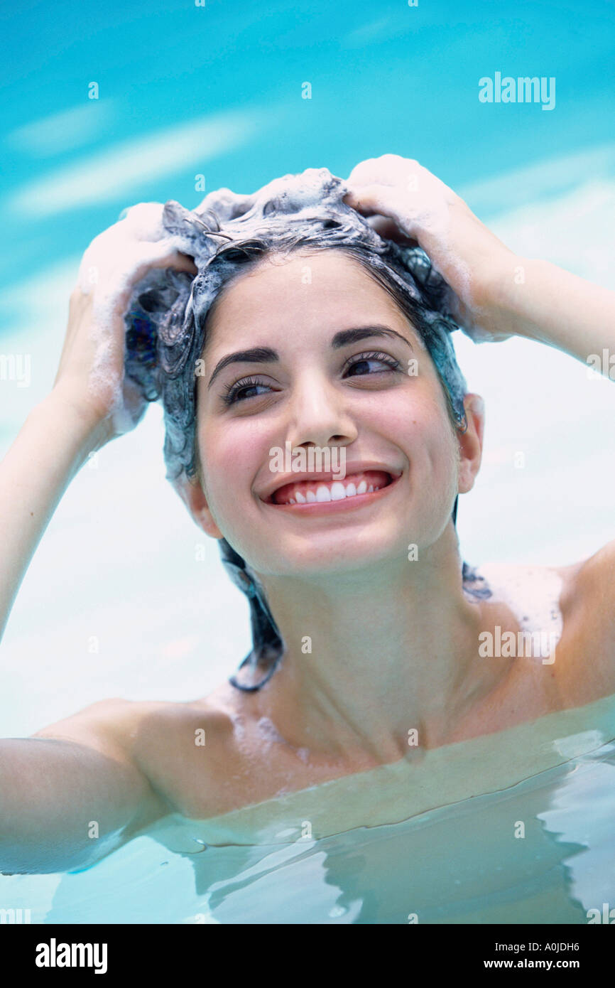 Woman washing her hair in a swimming pool Stock Photo - Alamy
