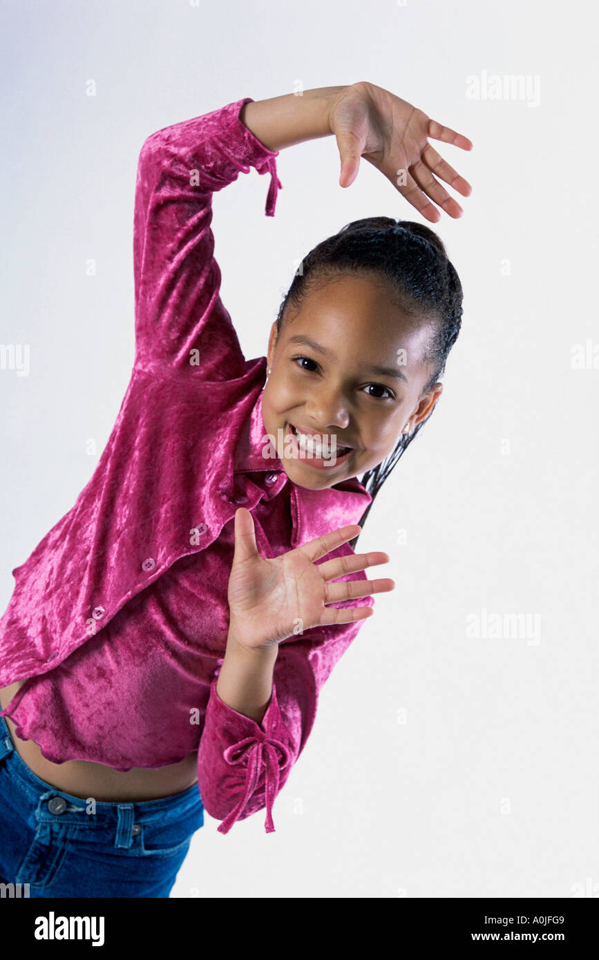 Portrait of a girl making hand gestures Stock Photo - Alamy