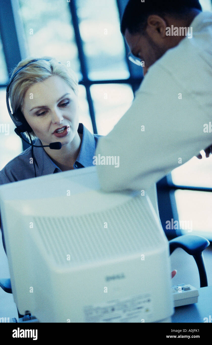 Two customer service representatives hi-res stock photography and ...