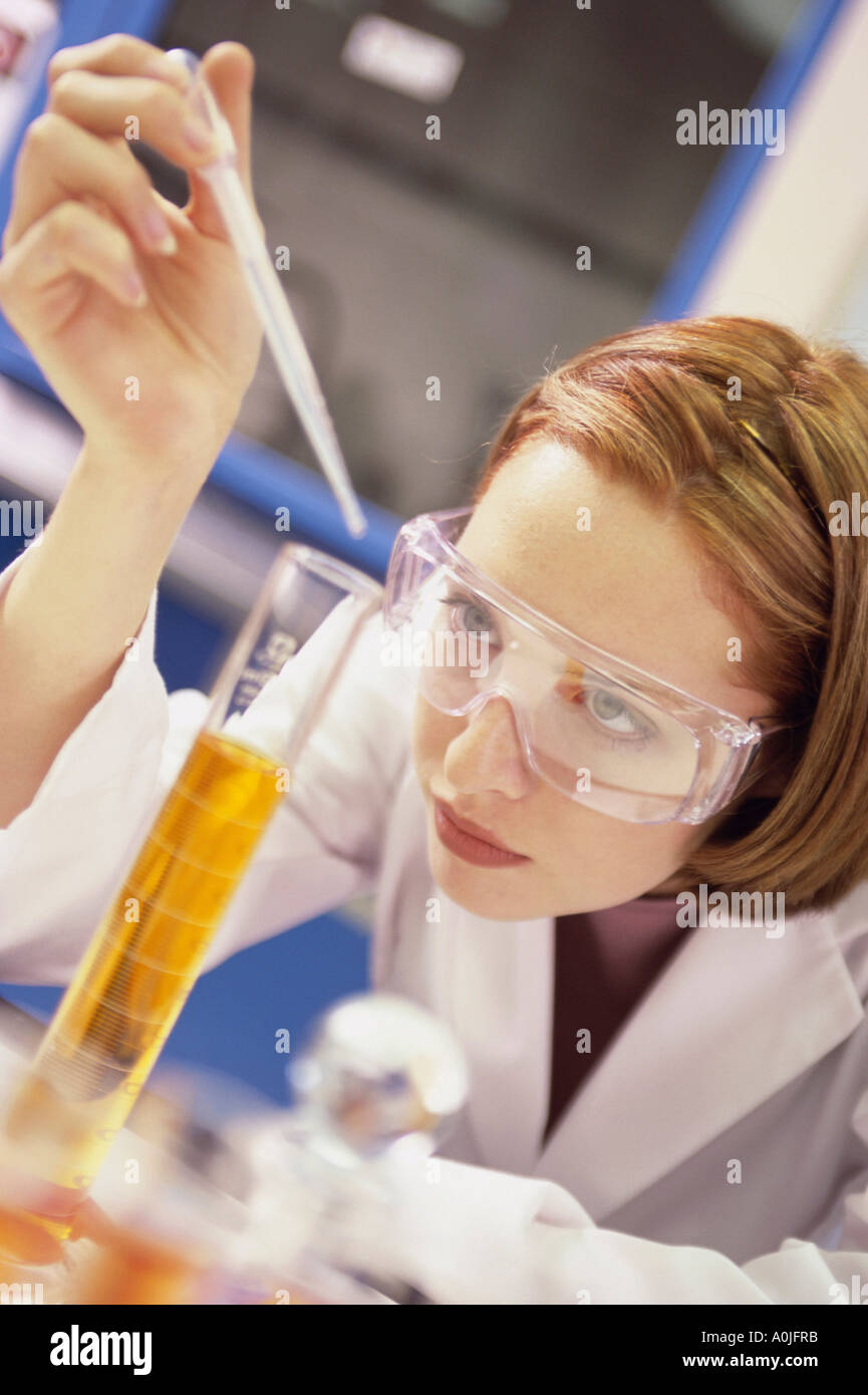 Female researcher working with chemicals Stock Photo - Alamy
