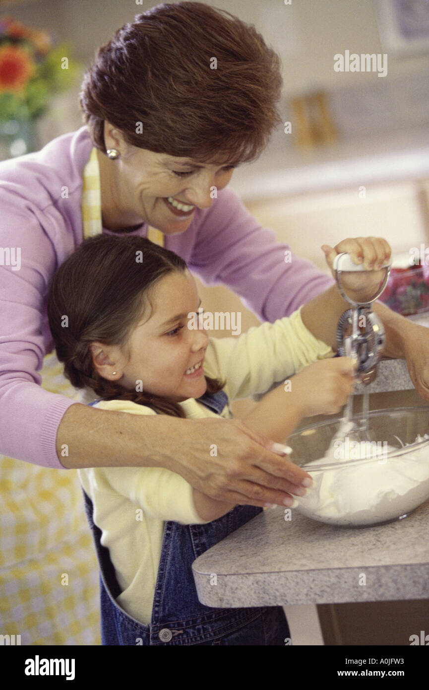 Mother and daughter baking a cake together Stock Photo - Alamy