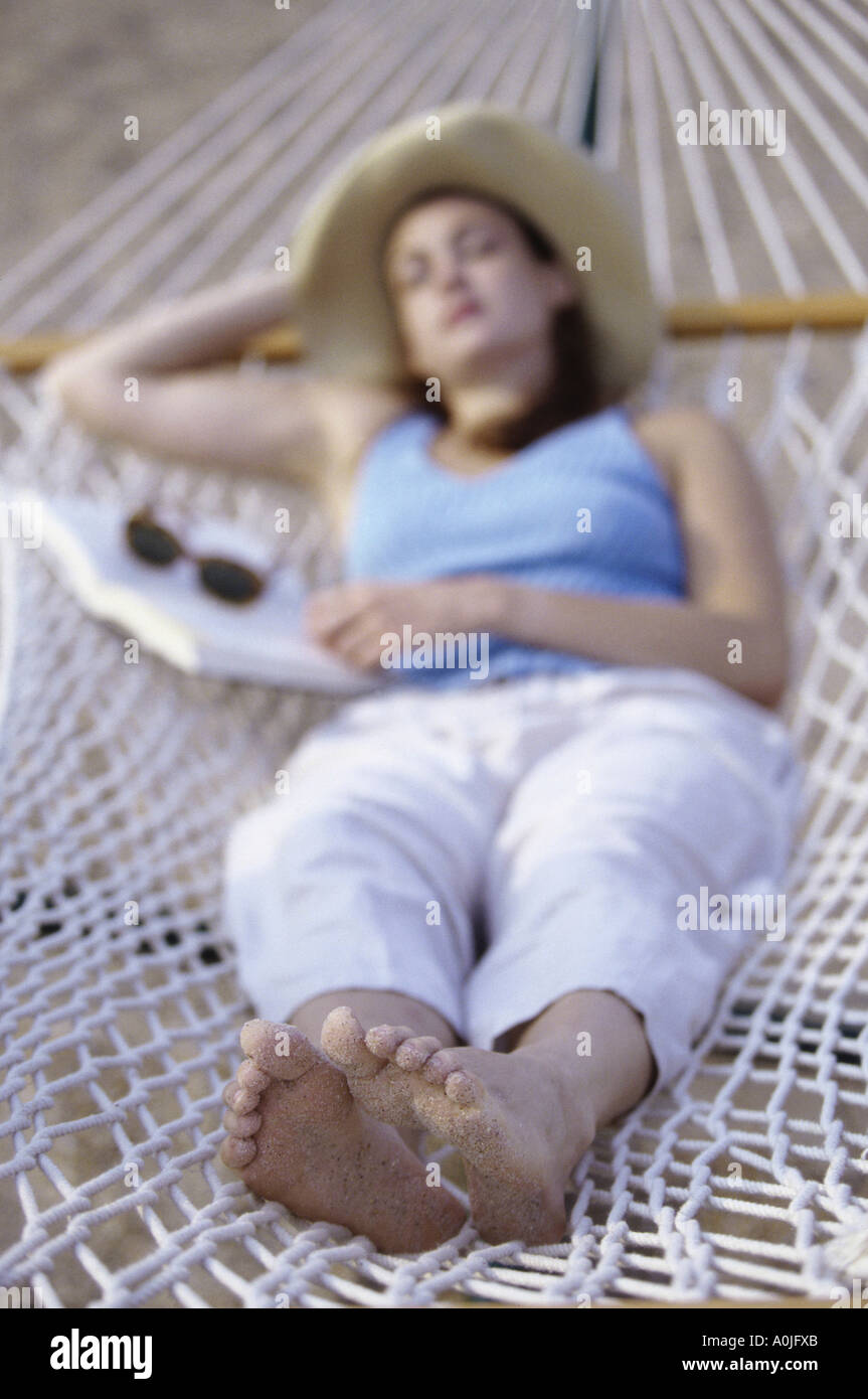 Young woman sleeping in a hammock Stock Photo - Alamy