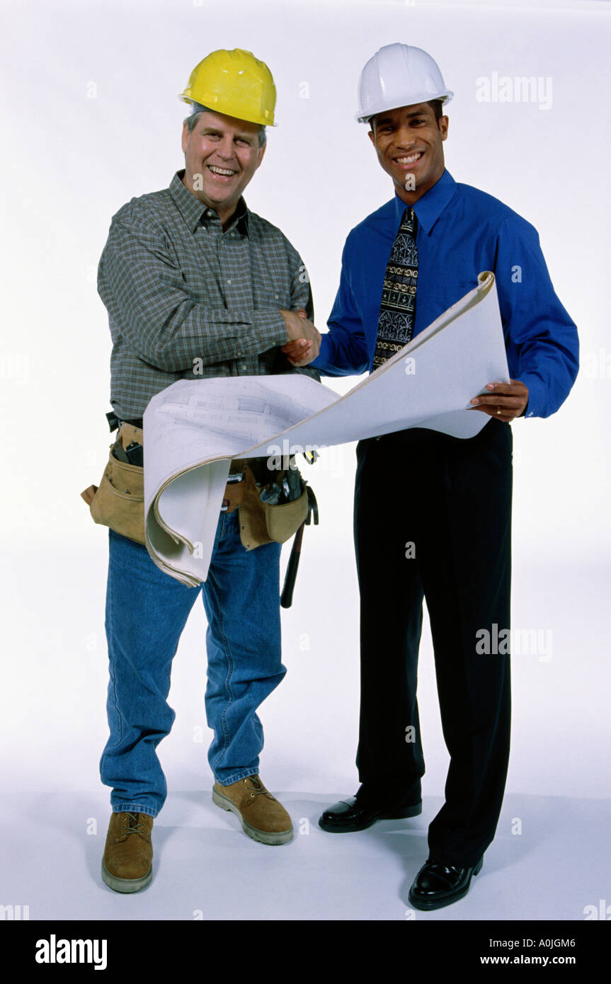 Portrait of two foremen shaking hands over a blueprint Stock Photo - Alamy