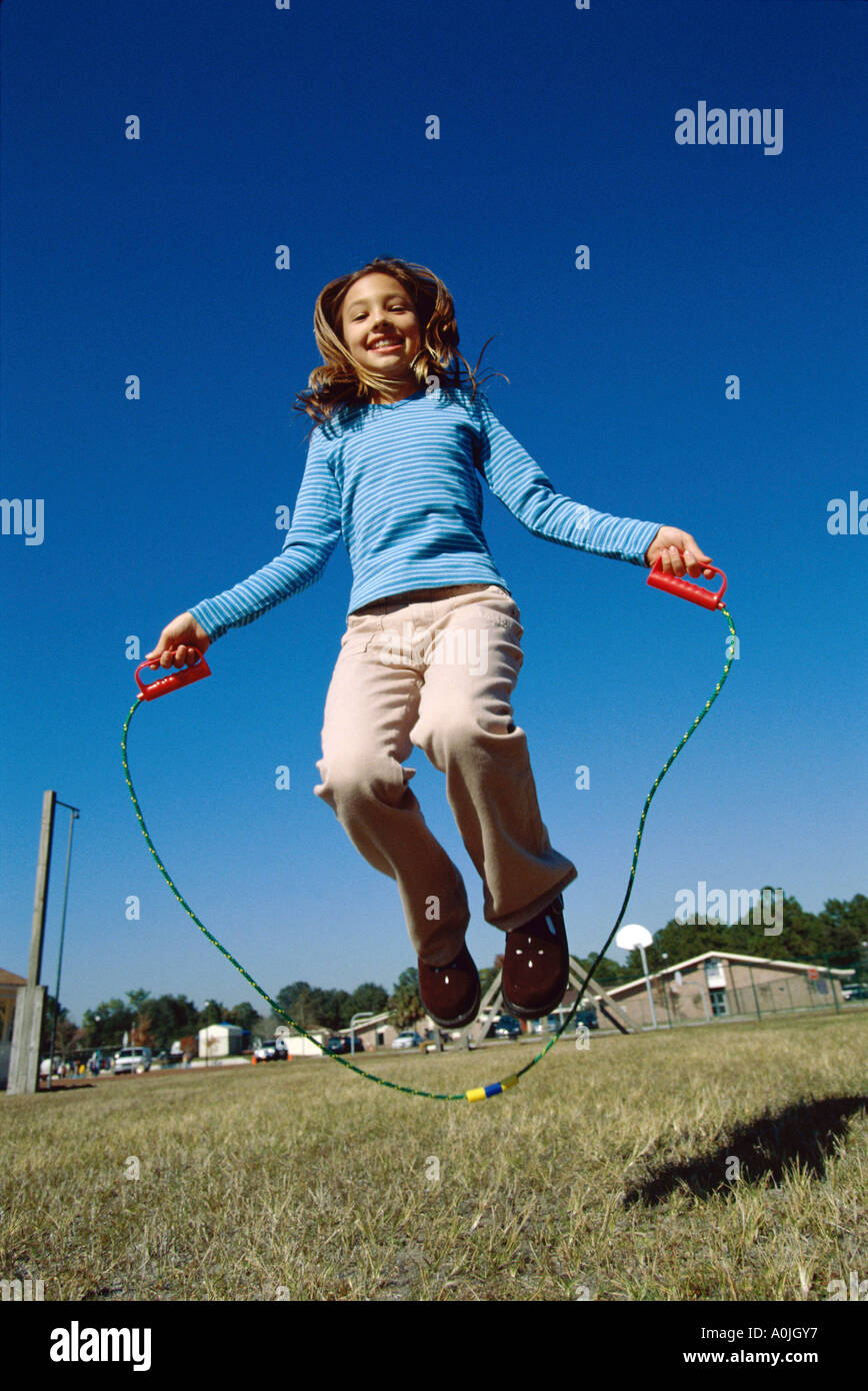Girl playing with a jump rope hi-res stock photography and images - Alamy